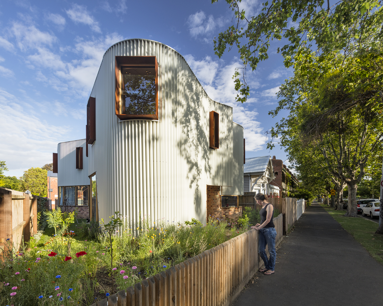 true north residence is a melbourne home wrapped in sinuous facade and ...