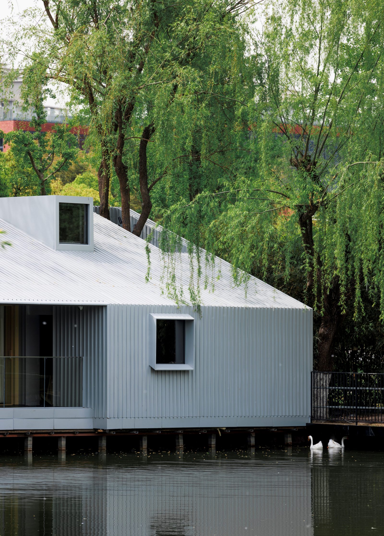 the lake house perches on stilts as a floating sanctuary in the woods ...