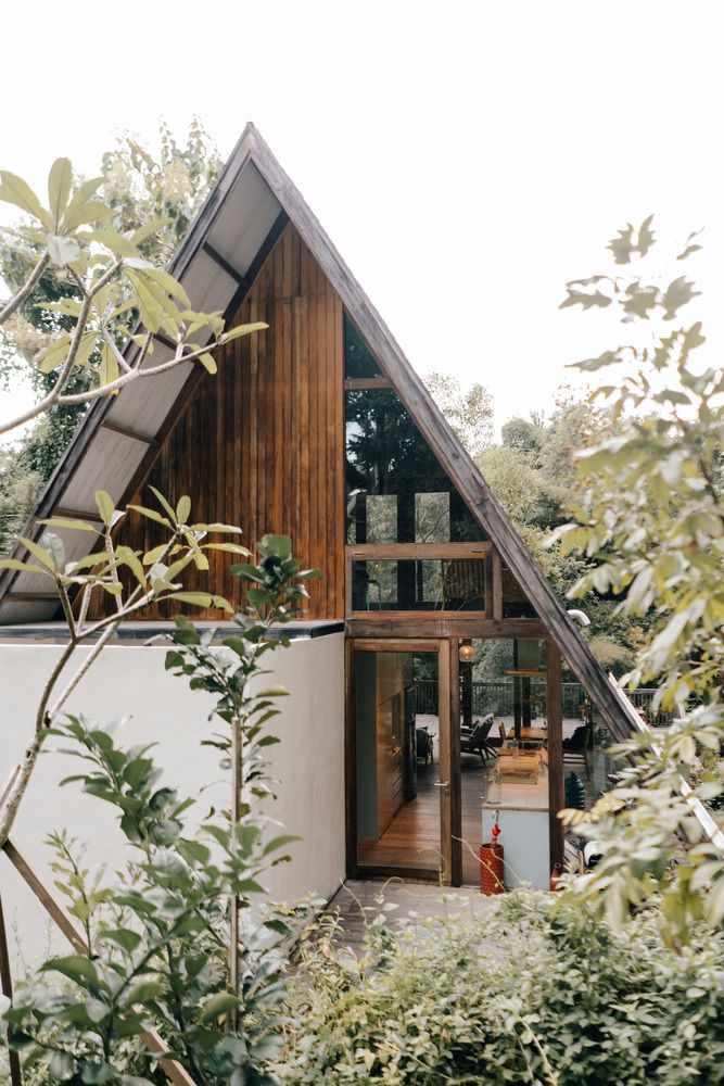 rl house is a stilt wooden sanctuary hidden amidst lombok's tranquil ...