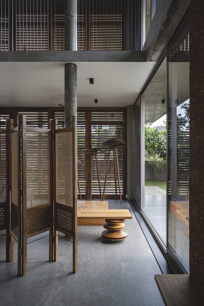 the slab house's open-air interiors and high ceilings generates ...