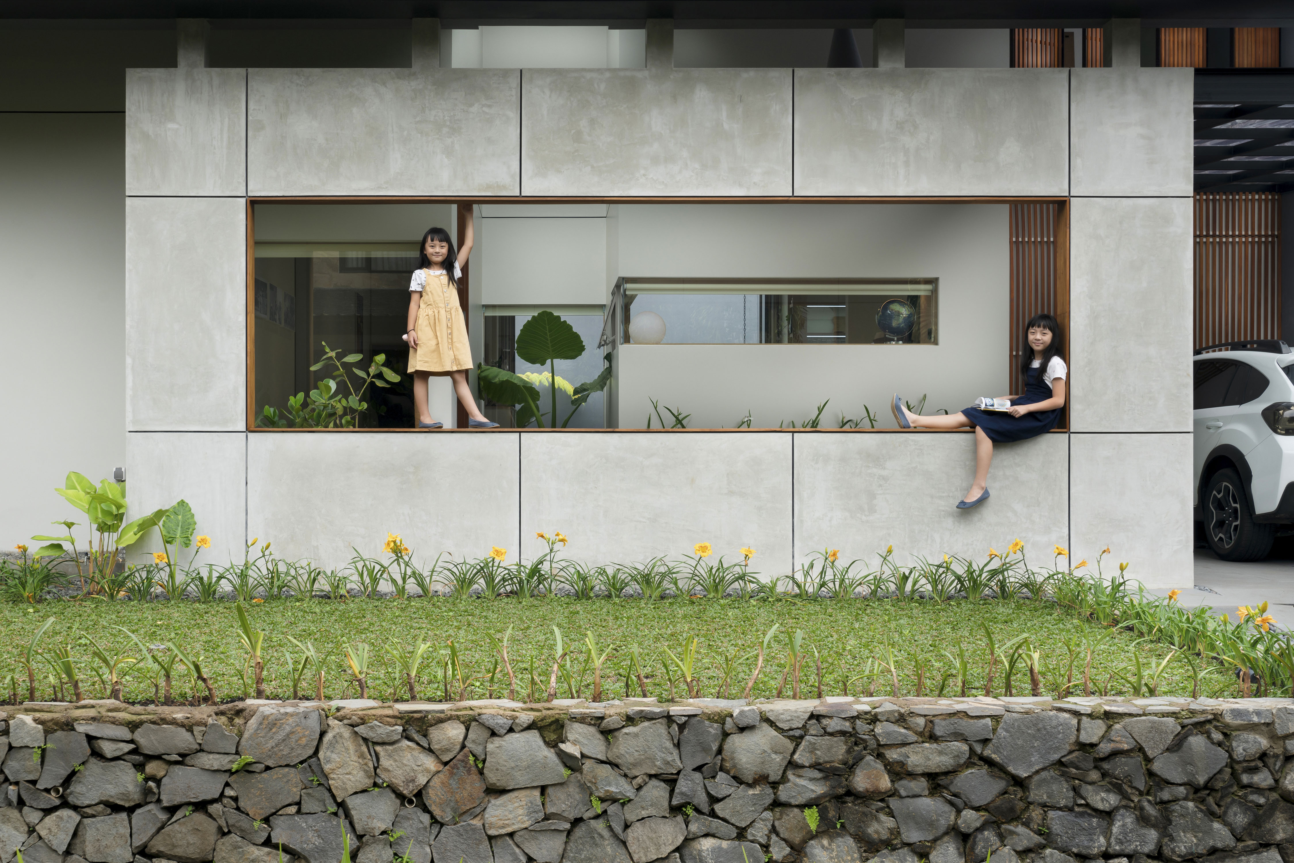 news: e.re studio architects incorporate concrete and wood on a simple ...