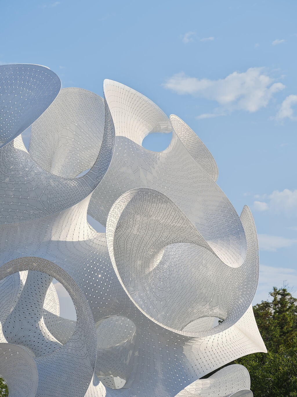 news: the orb is a sculptural pavilion resembling “a moon carved from ...