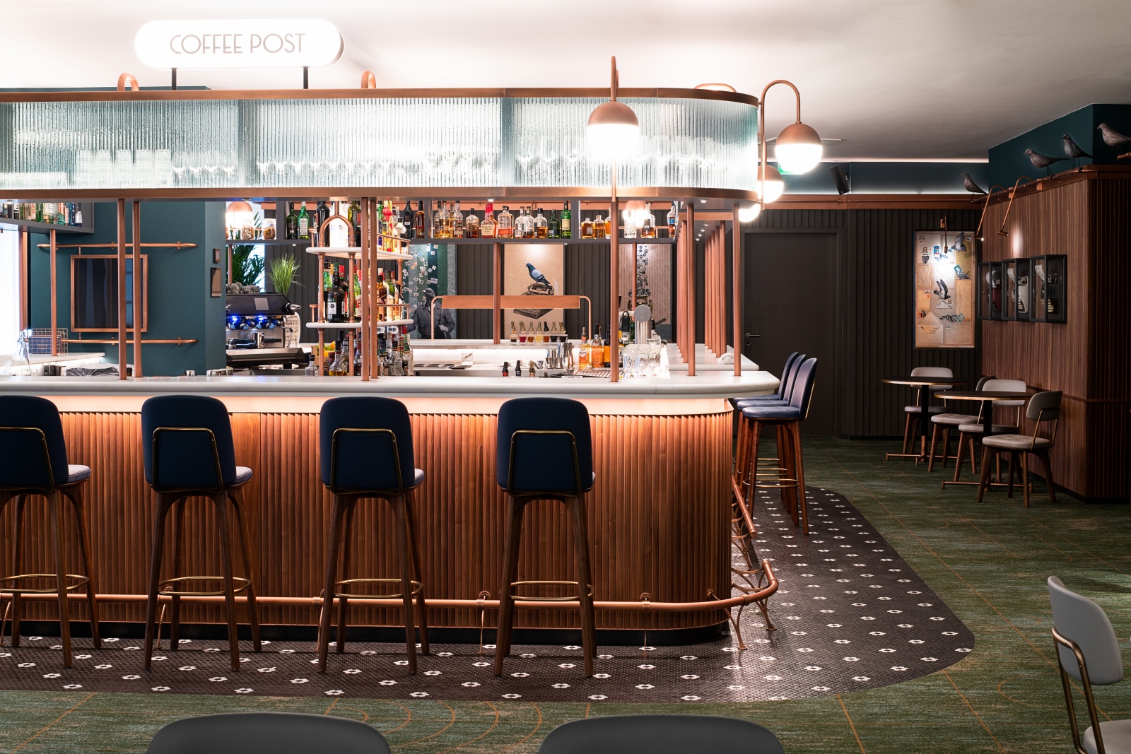 inside a retro-inspired pigeon post-bar & eatery at hilton cologne ...
