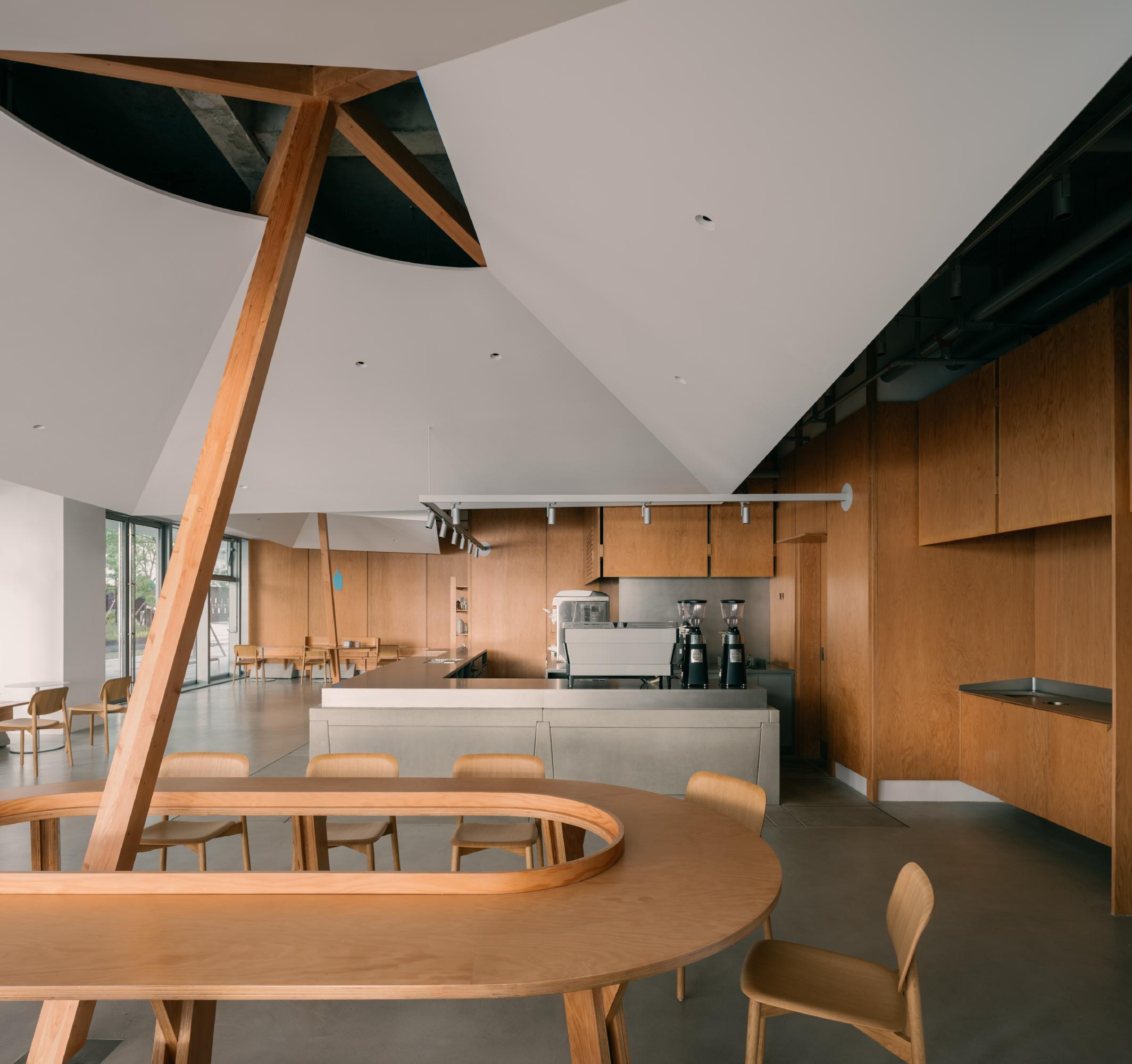 atelier tao+c completes a serene timber-filled blue bottle coffee in ...