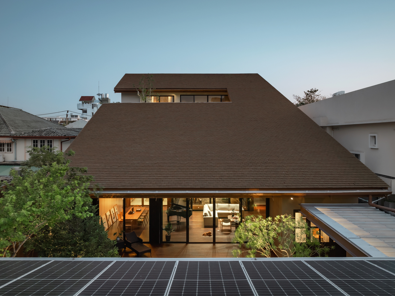 roof house redefines multigenerational living with a courtyard and open ...