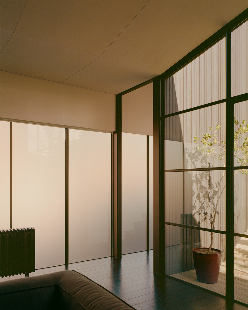 house b embraces diffused light and frosted panels for ethereal ...