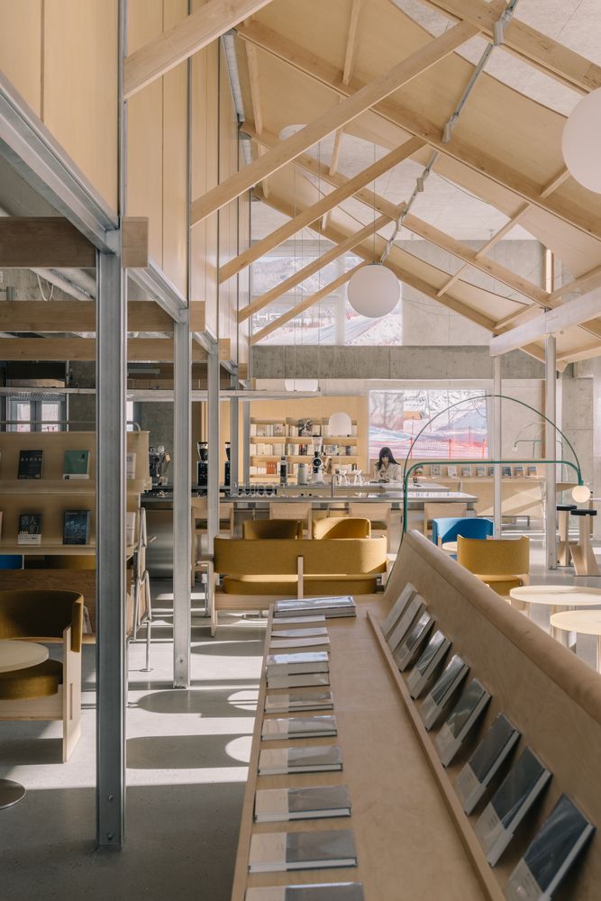 naïve bookstore utilizes warm and honest materials to frame literary ...