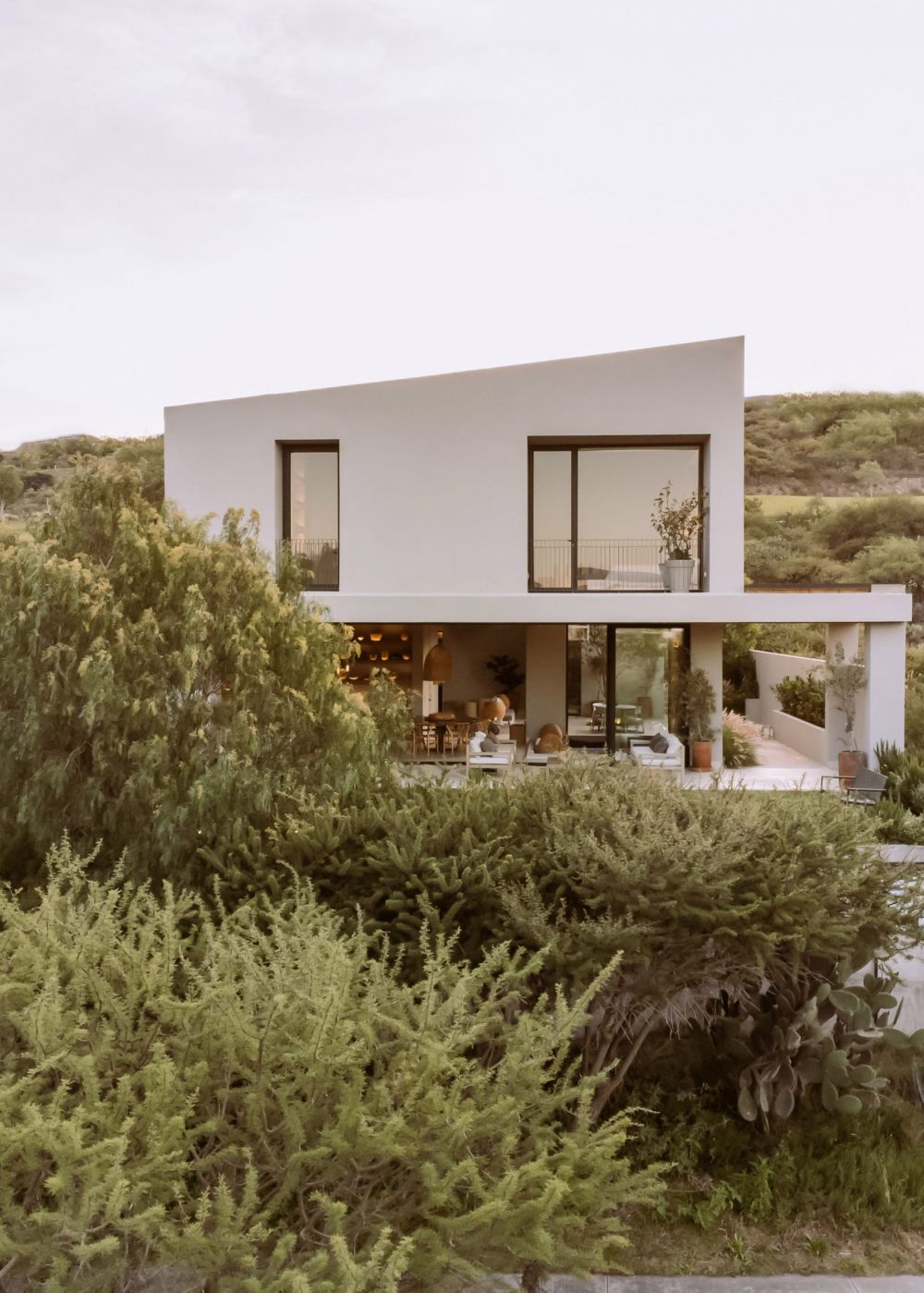 nature and craftsmanship enveloped within the u-shaped casa camelia ...