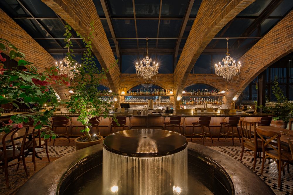 brick arches and vintage ambiance at aom dining club in bandung ...