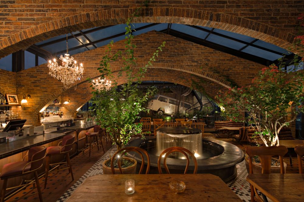 brick arches and vintage ambiance at aom dining club in bandung ...
