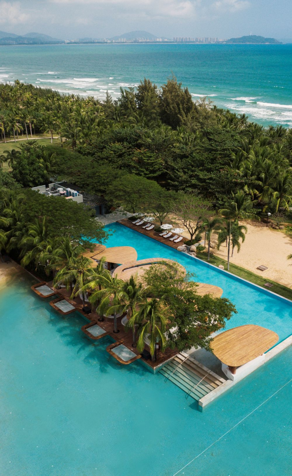 the sanya edition's renewed beach club indulges guests underneath ...