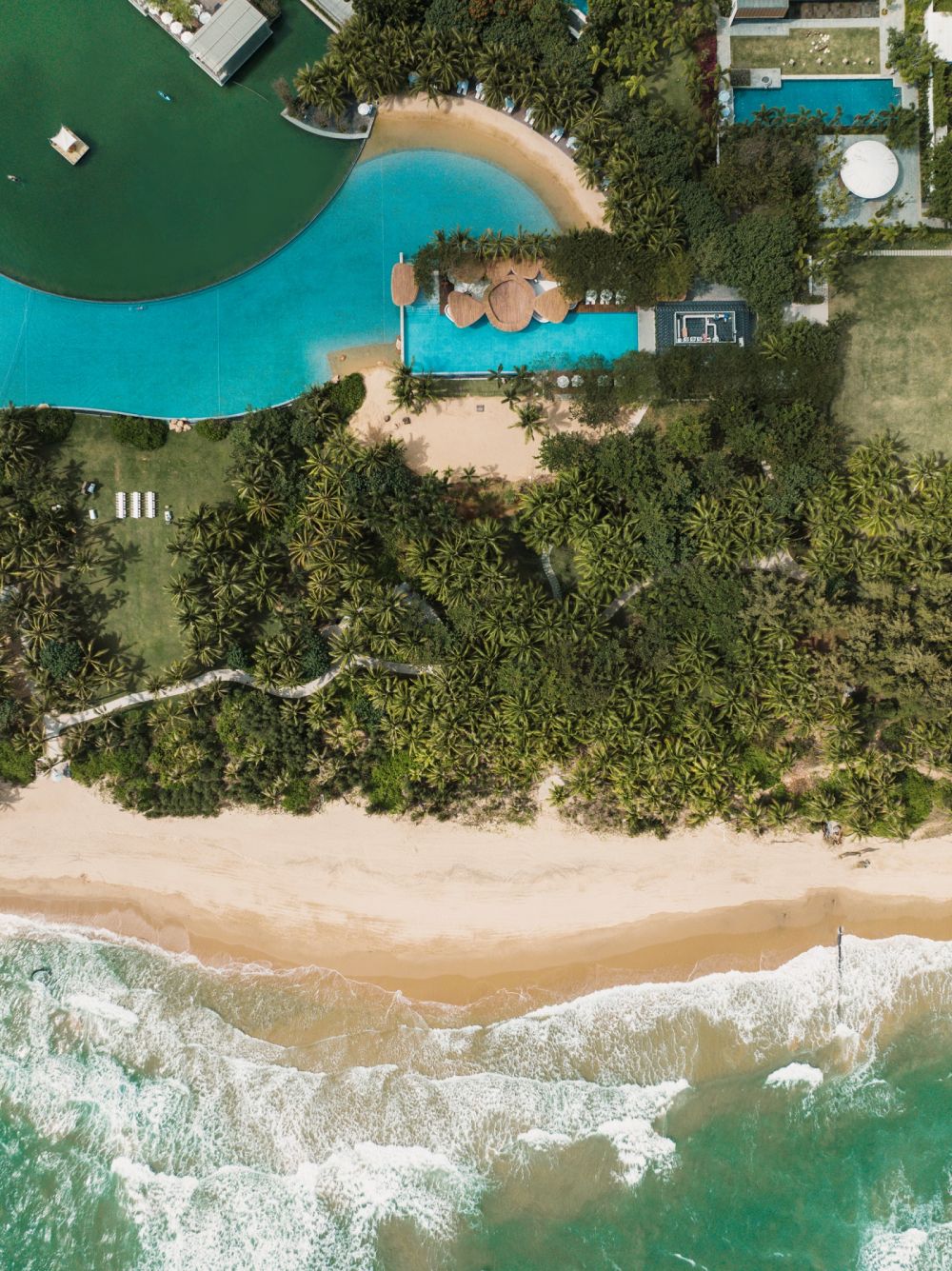 the sanya edition's renewed beach club indulges guests underneath ...