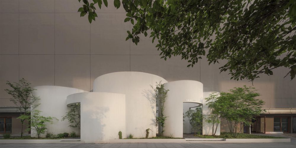 white and curvaceous, simple design archive emerges as a living ...