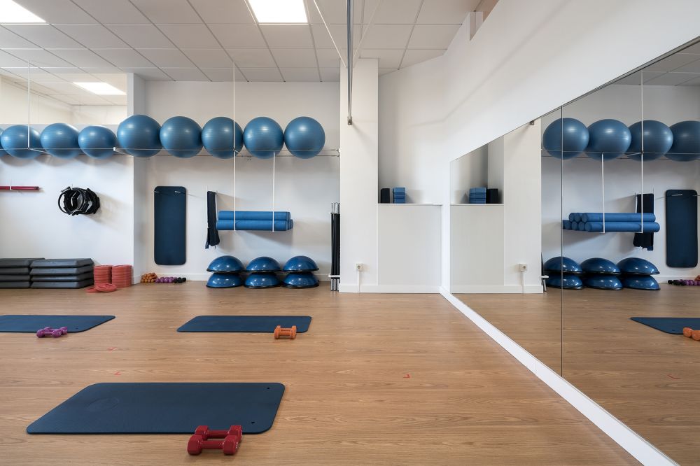 a contemplative physiotherapy center wrapped in smooth wooden interior ...