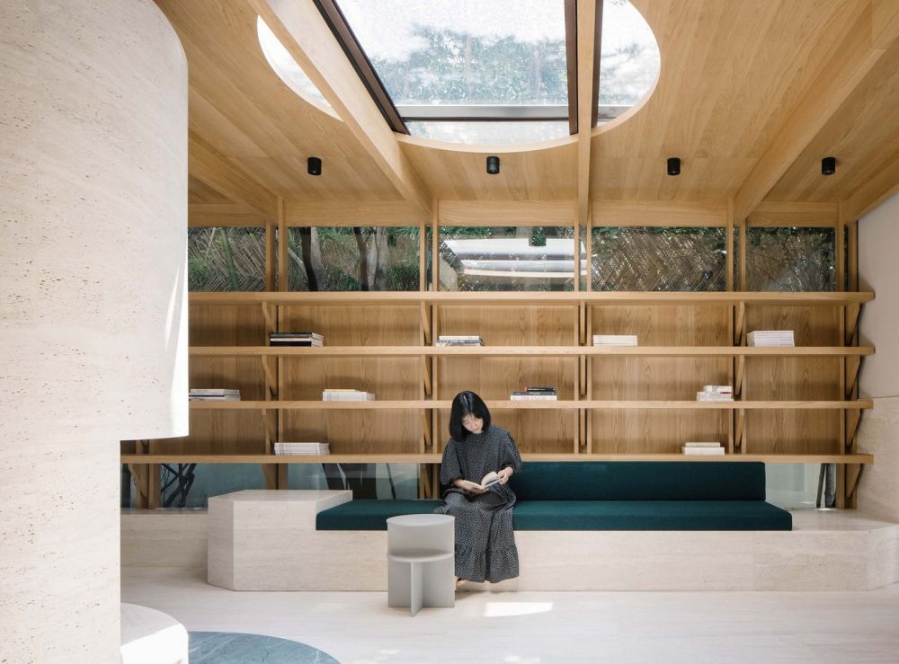 an introverted reading space with wood and beams: project by atelier ...