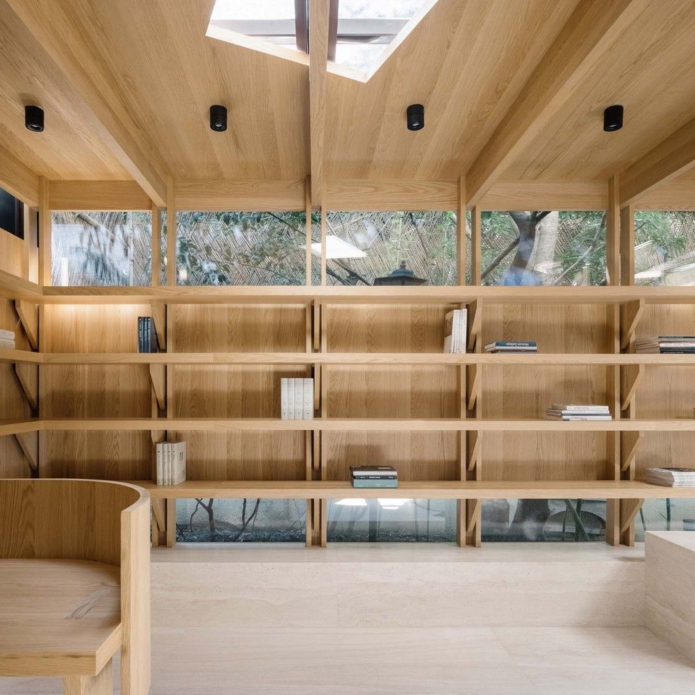 an introverted reading space with wood and beams: project by atelier ...