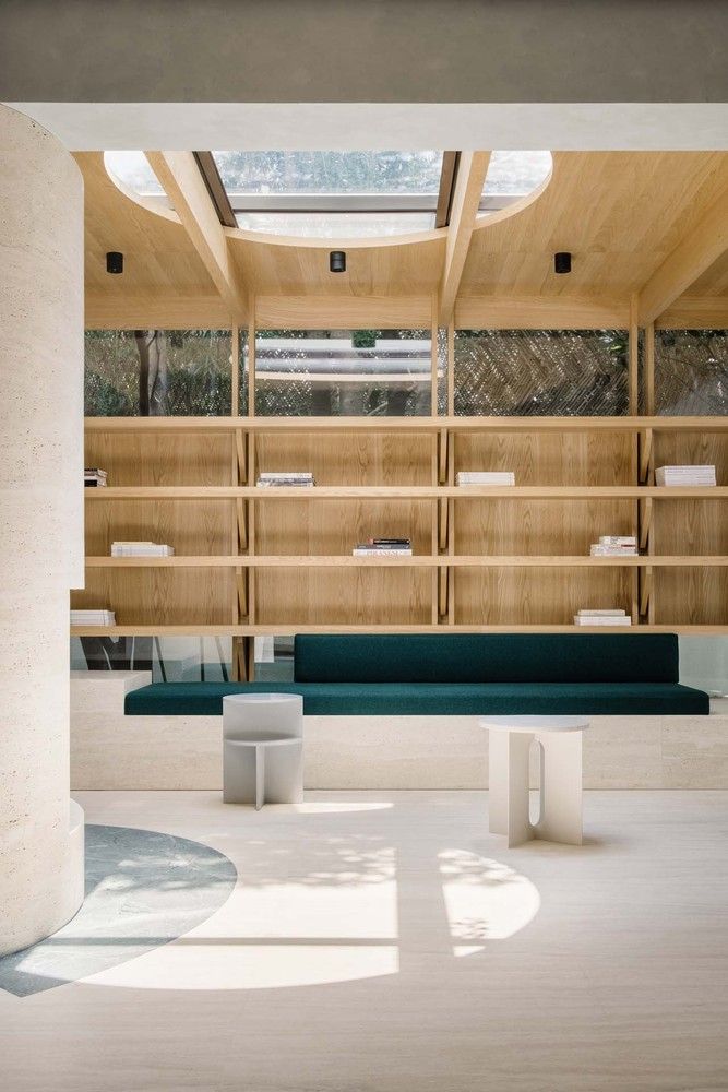 an introverted reading space with wood and beams: project by atelier ...