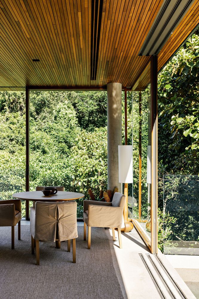 news: the vjc iporanga house is designed to blend with the lush ...