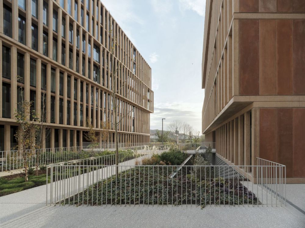 a contemporary spanish residential complex attached to lush green ...