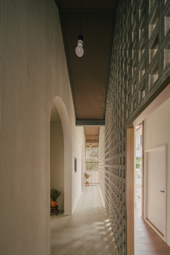 flow house combines nature and earthy materials for a cozy retirement ...