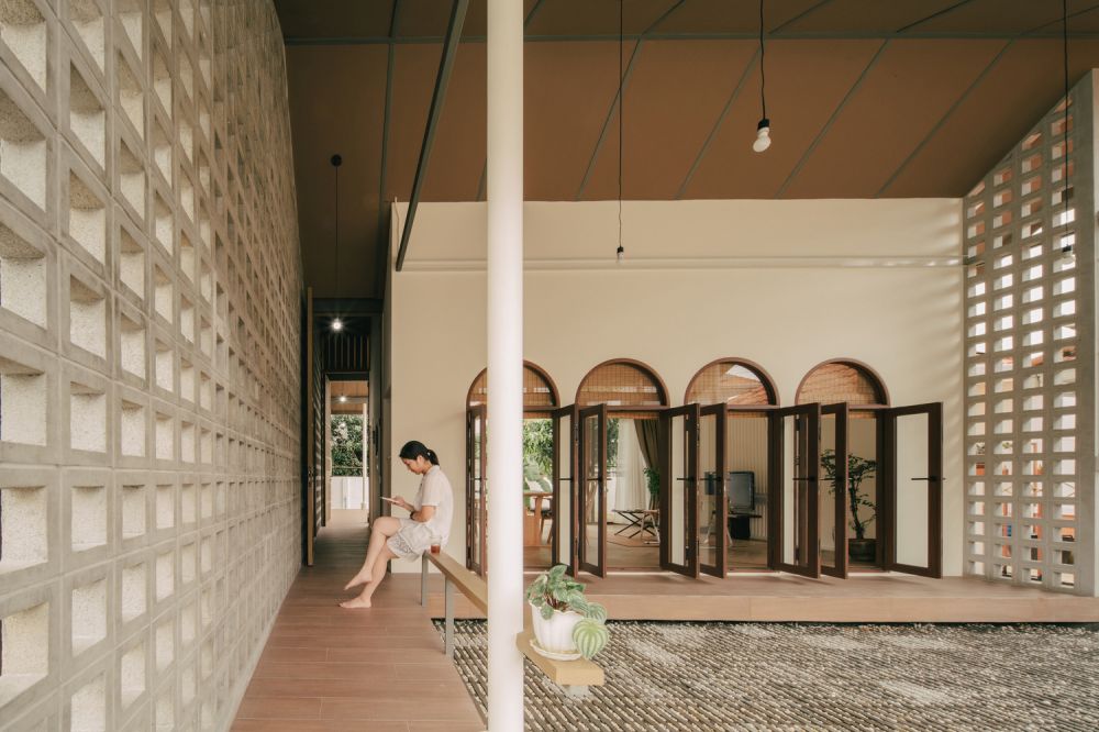 flow house combines nature and earthy materials for a cozy retirement ...