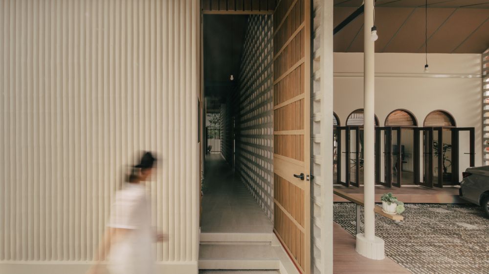 flow house combines nature and earthy materials for a cozy retirement ...