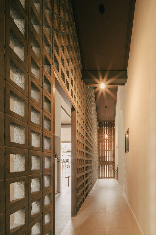 flow house combines nature and earthy materials for a cozy retirement ...