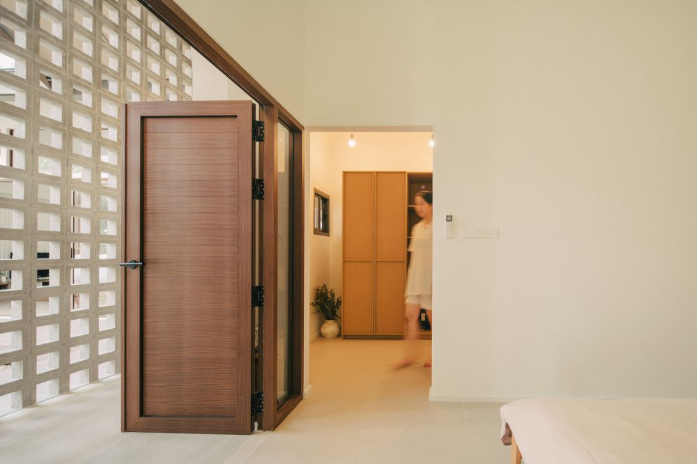 flow house combines nature and earthy materials for a cozy retirement ...