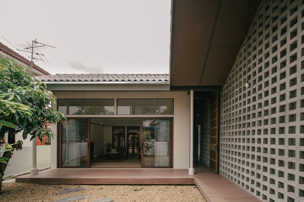 flow house combines nature and earthy materials for a cozy retirement ...