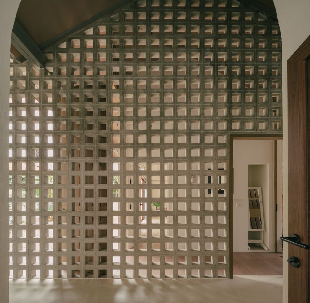 flow house combines nature and earthy materials for a cozy retirement ...