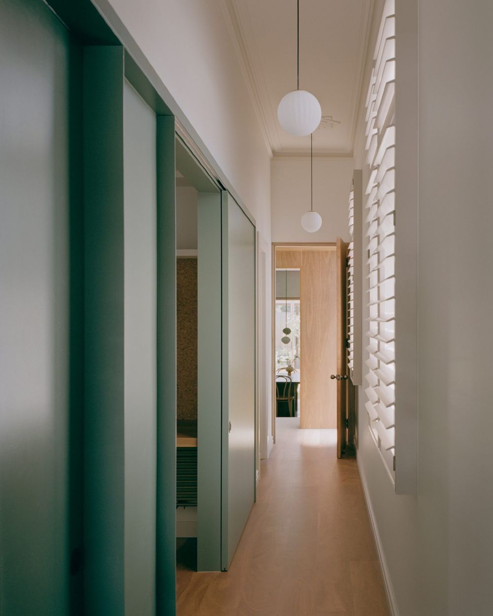 garden tower house combines a serene garden and soft hues to reinforce ...