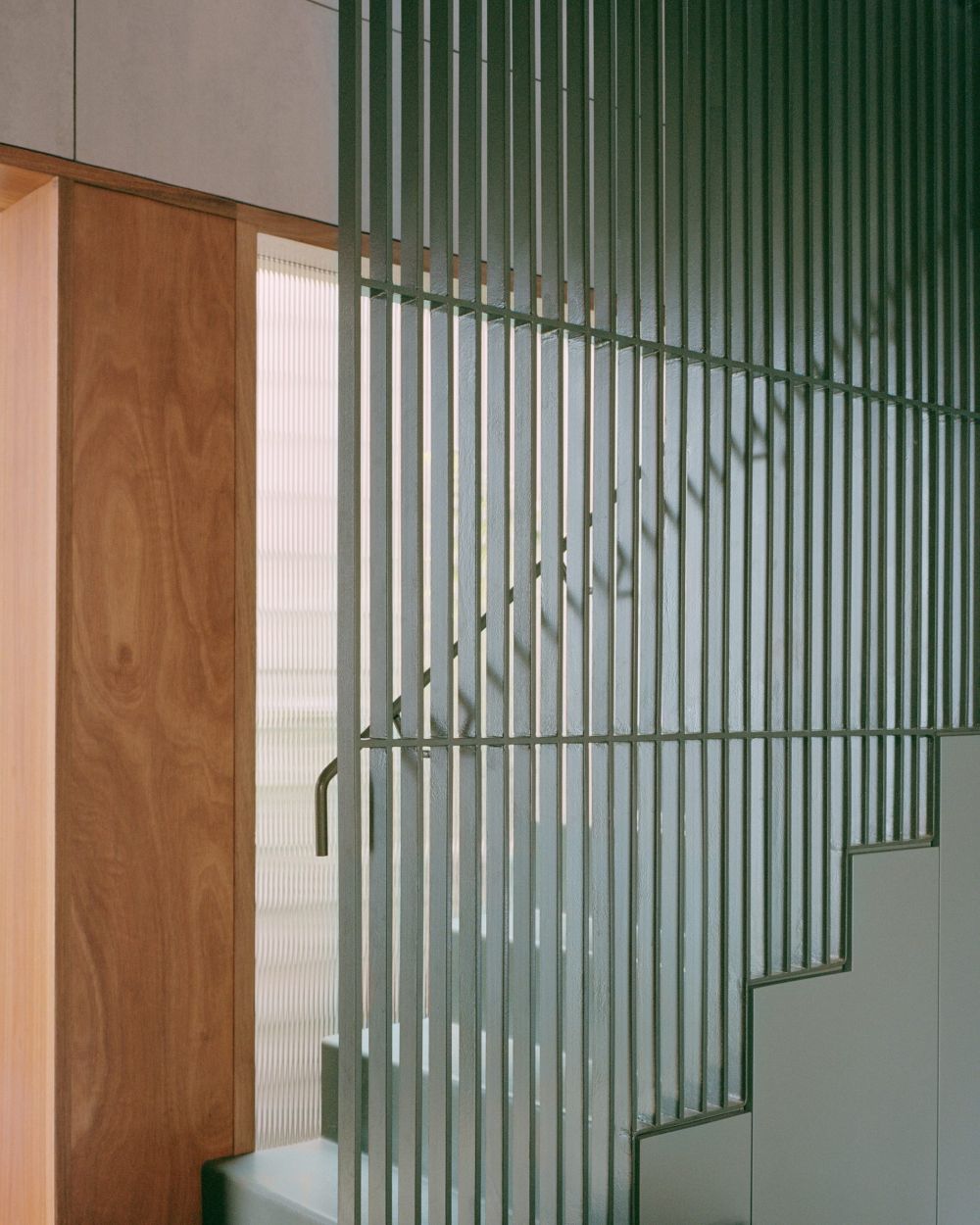 garden tower house combines a serene garden and soft hues to reinforce ...