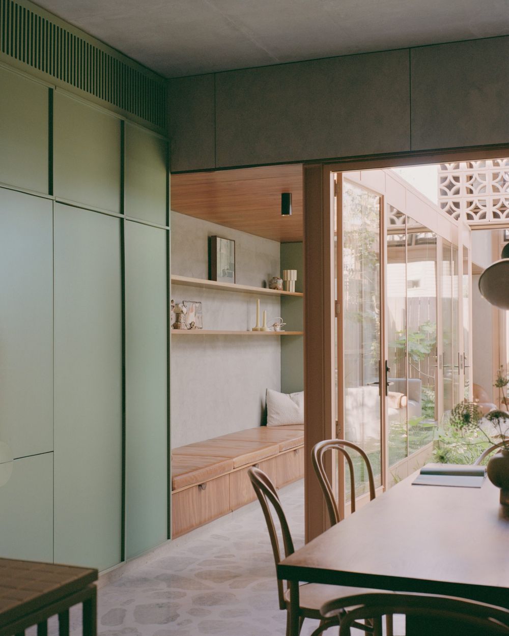 garden tower house combines a serene garden and soft hues to reinforce ...
