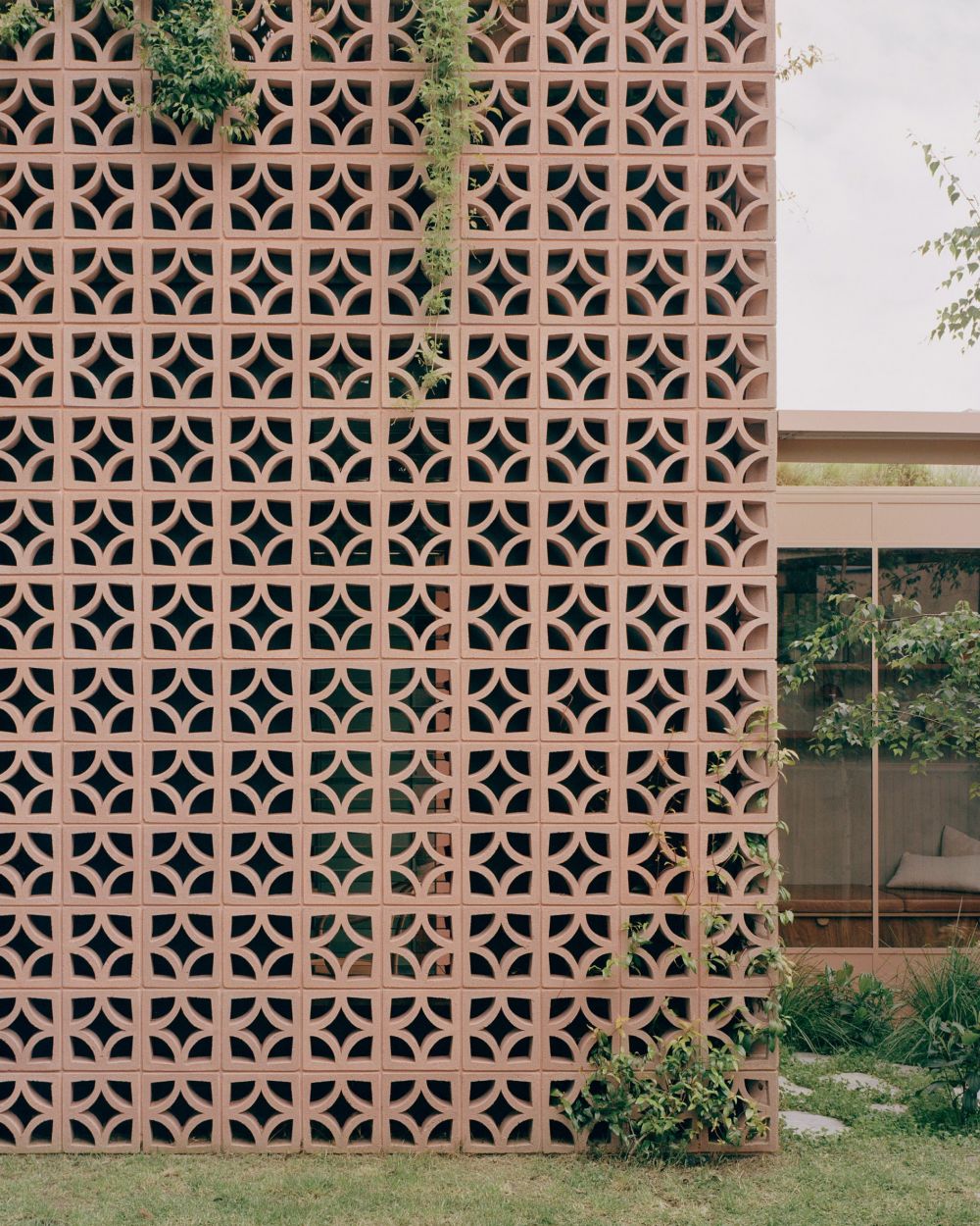 garden tower house combines a serene garden and soft hues to reinforce ...