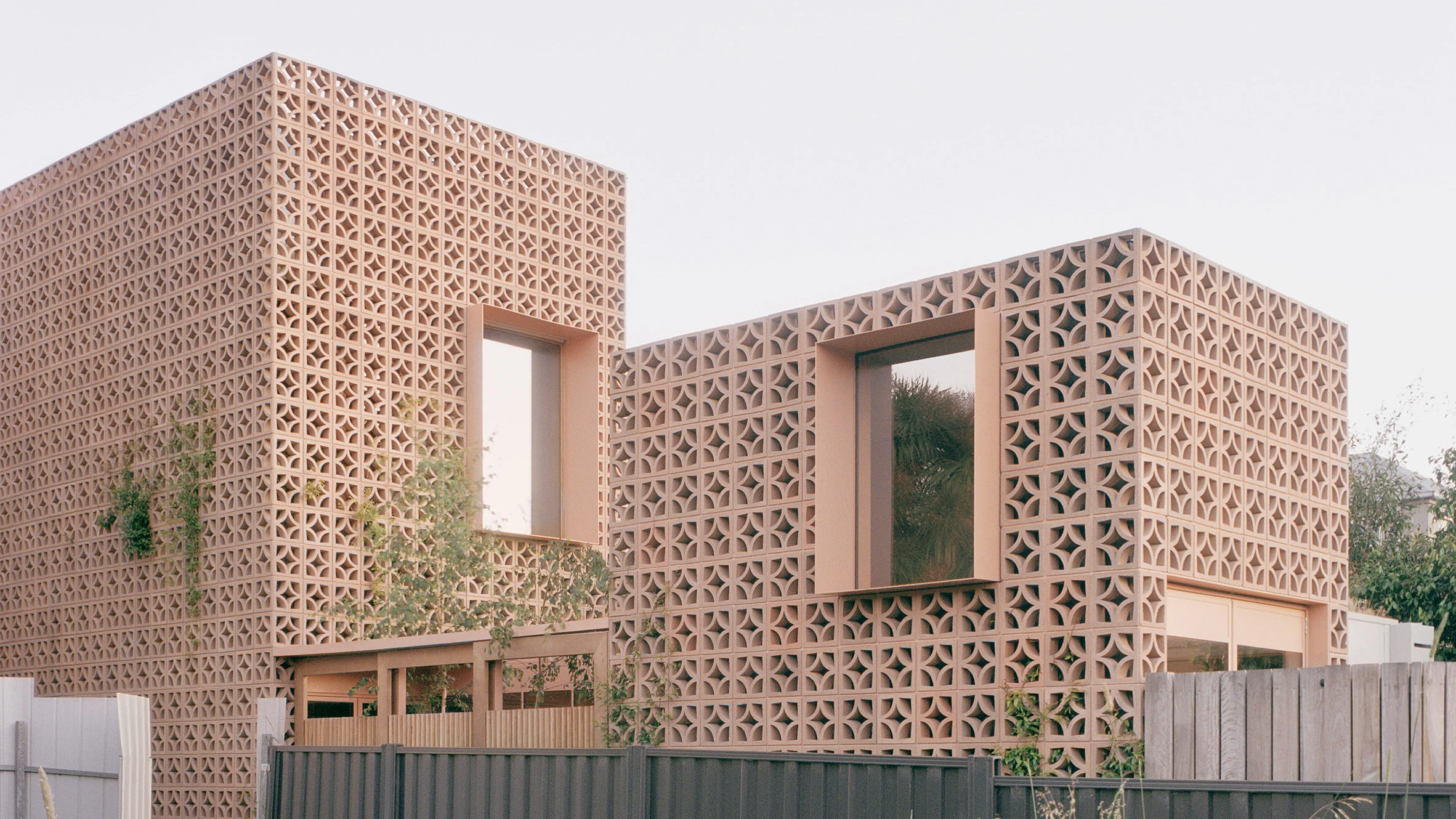 garden tower house combines a serene garden and soft hues to reinforce ...