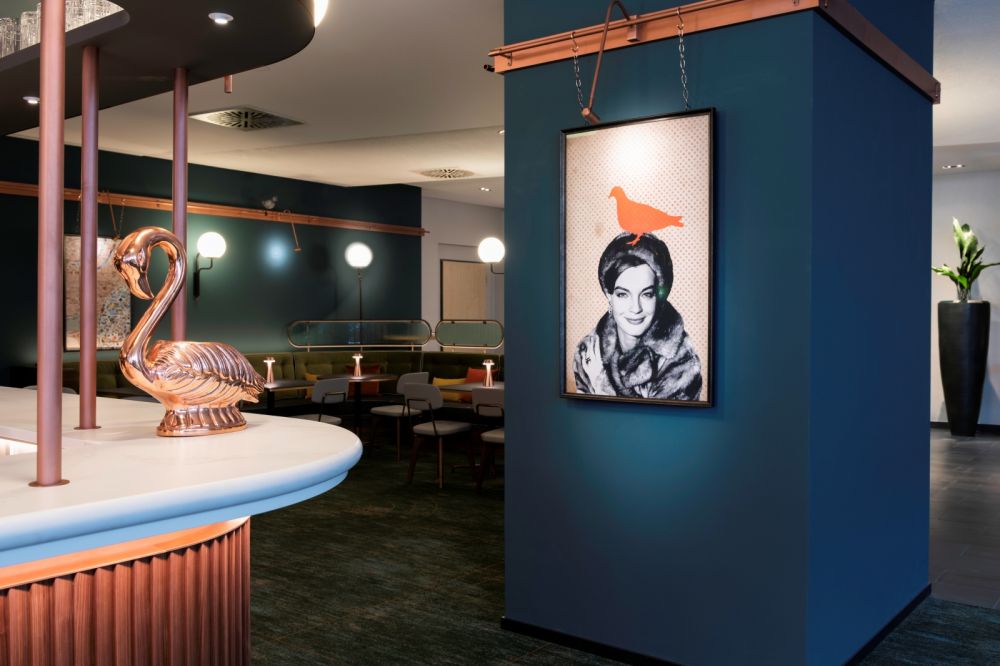 inside a retro-inspired pigeon post-bar & eatery at hilton cologne ...