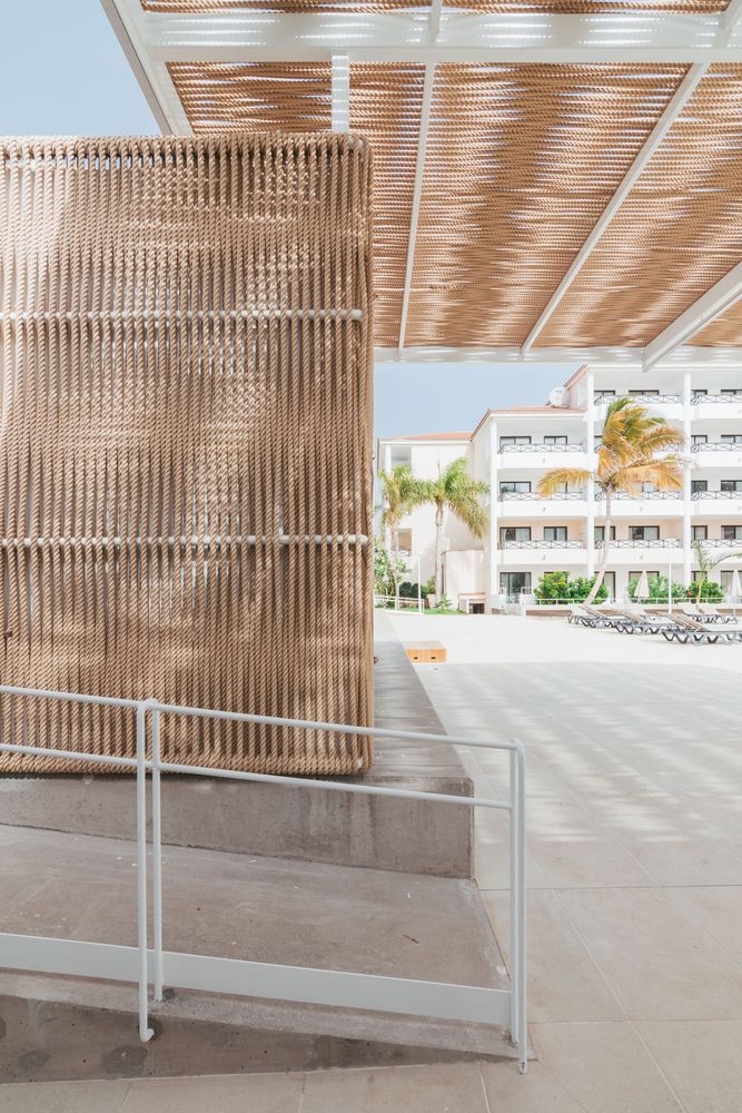 utilizing hand-woven canopy on hotel parque la paz refurbishment ...