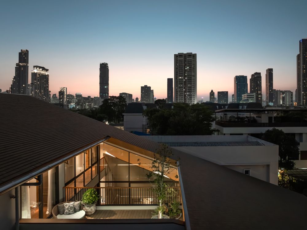 roof house redefines multigenerational living with a courtyard and open ...