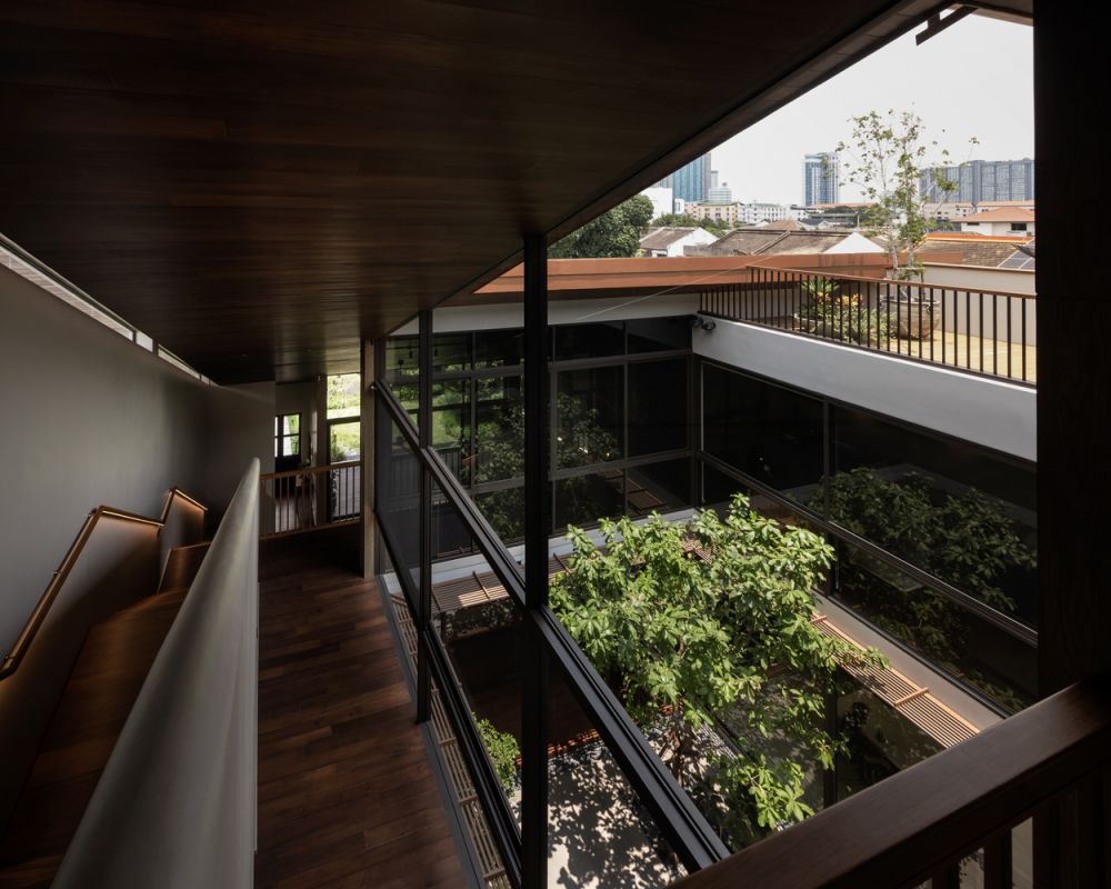 roof house redefines multigenerational living with a courtyard and open ...