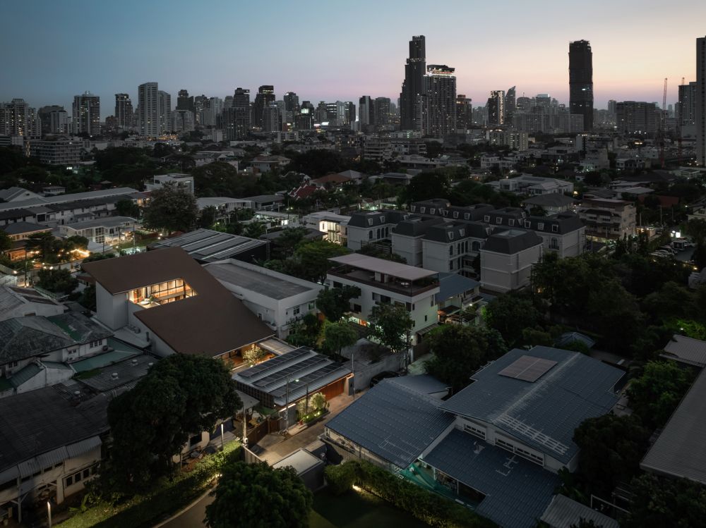 roof house redefines multigenerational living with a courtyard and open ...