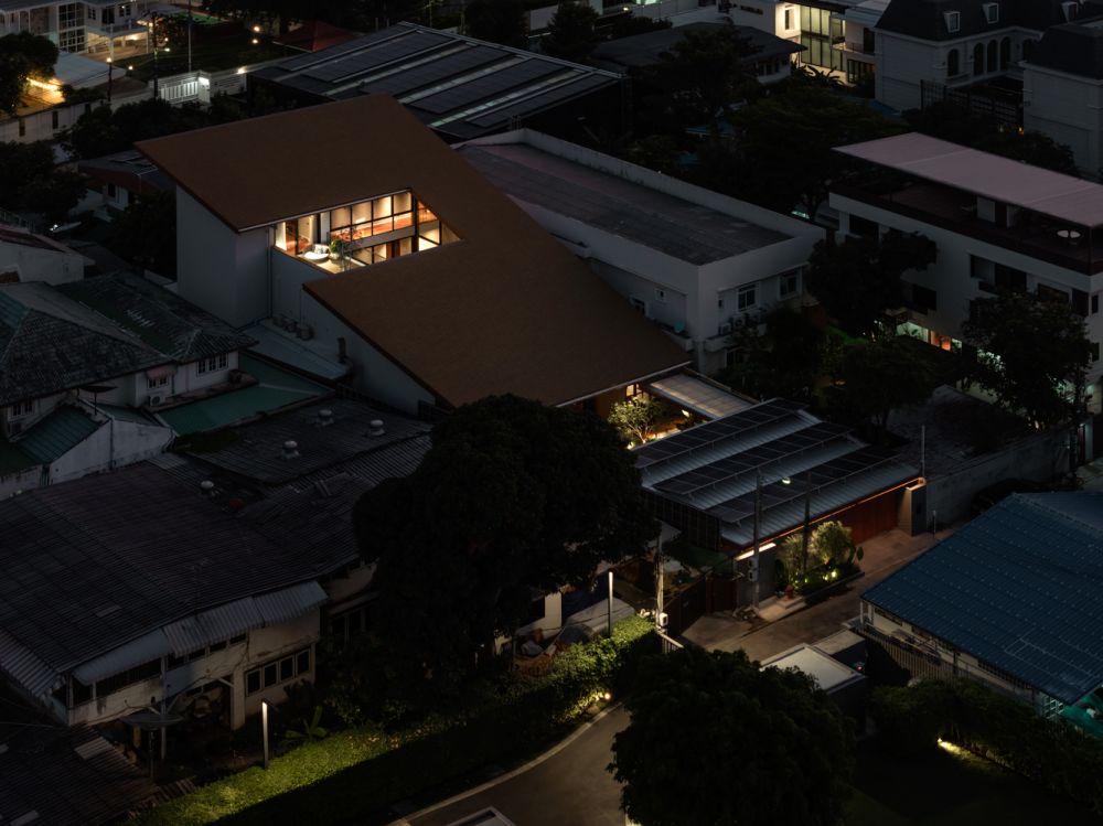 roof house redefines multigenerational living with a courtyard and open ...