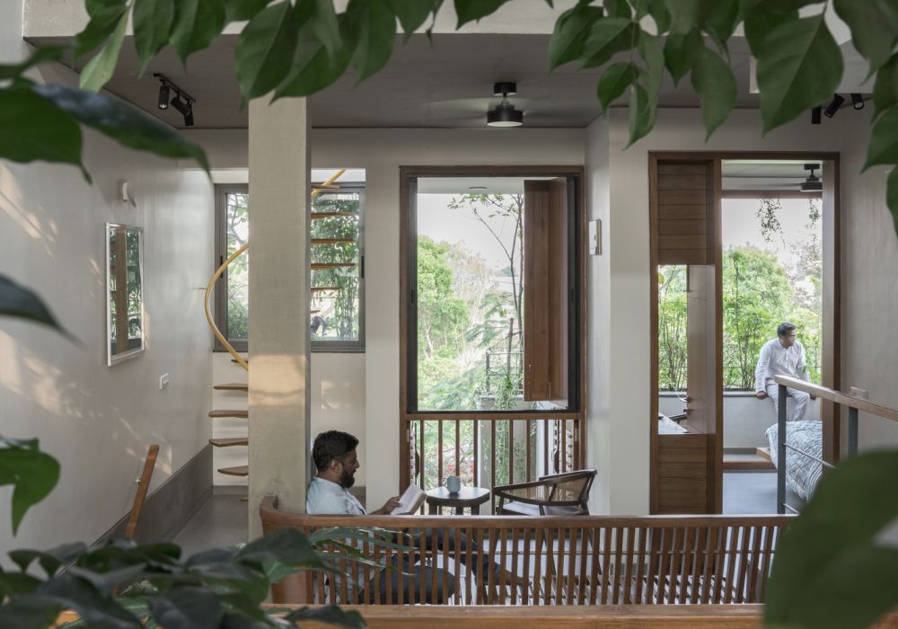 a threshold harmonizes nature and architecture in the compact and ...