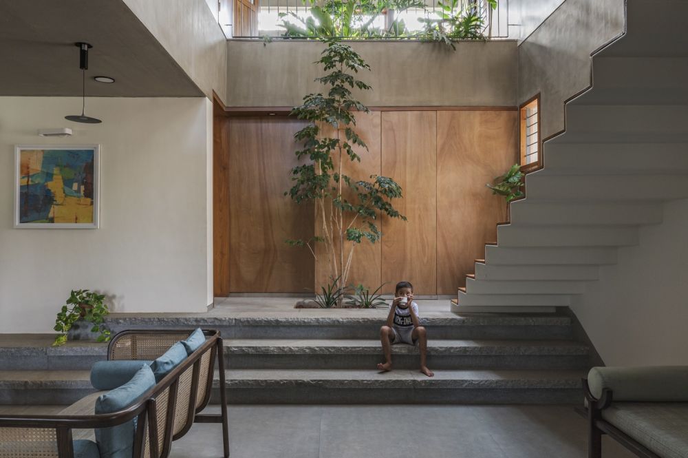 a threshold harmonizes nature and architecture in the compact and ...
