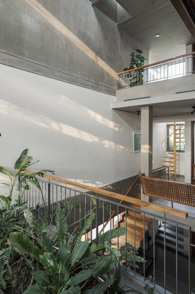 a threshold harmonizes nature and architecture in the compact and ...