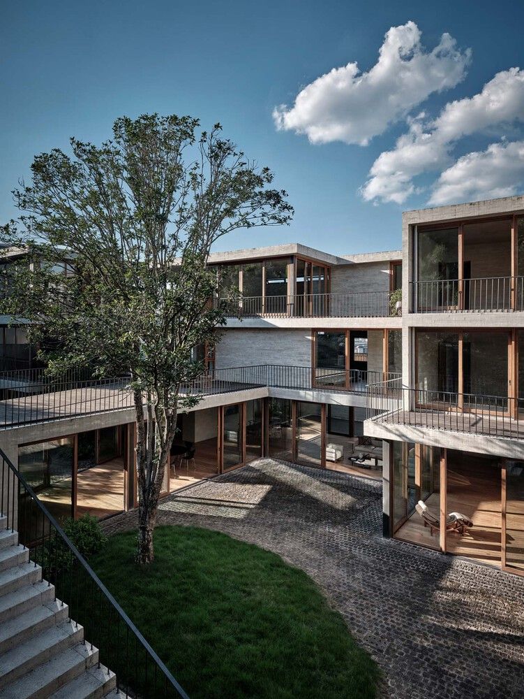 zhaoyang architects blends modern-industrial accents and nature into a ...