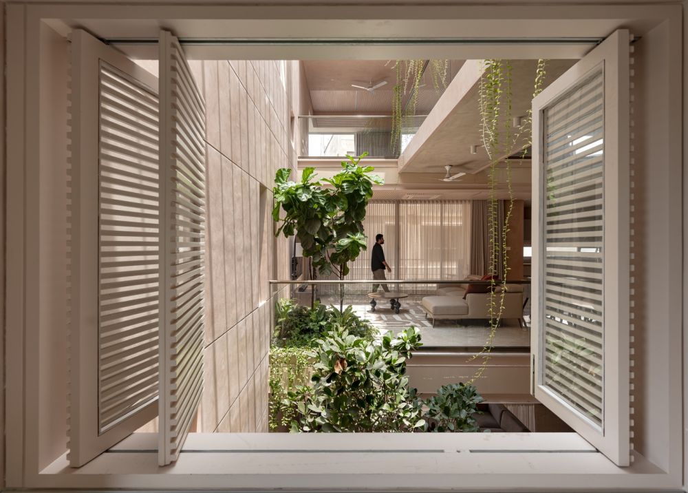 spacefiction studio completes a contemporary organic home with abundant ...