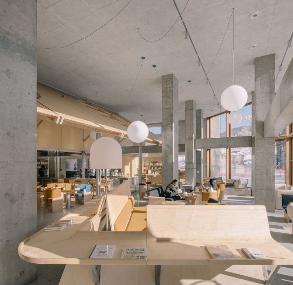 naïve bookstore utilizes warm and honest materials to frame literary ...