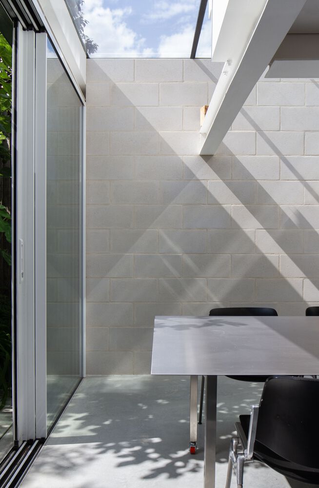 oasis house is a light-filled sanctuary amid a lush hidden garden ...