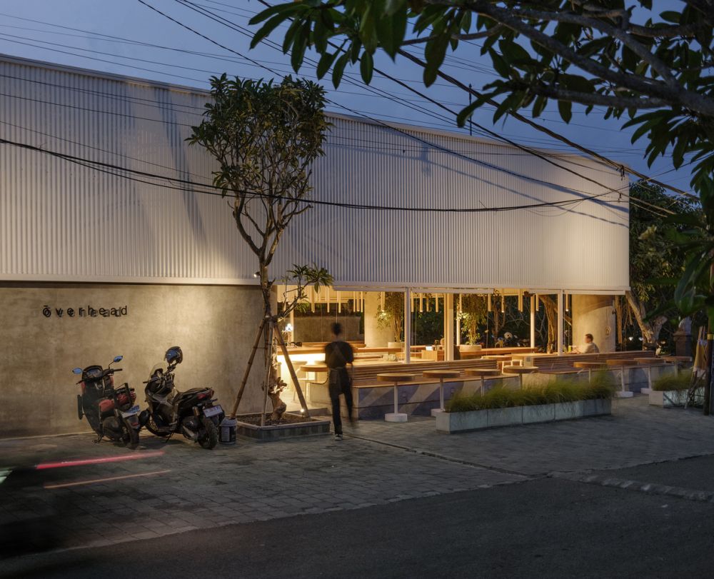 overhead restaurant promotes indoor-outdoor connection with wallless ...
