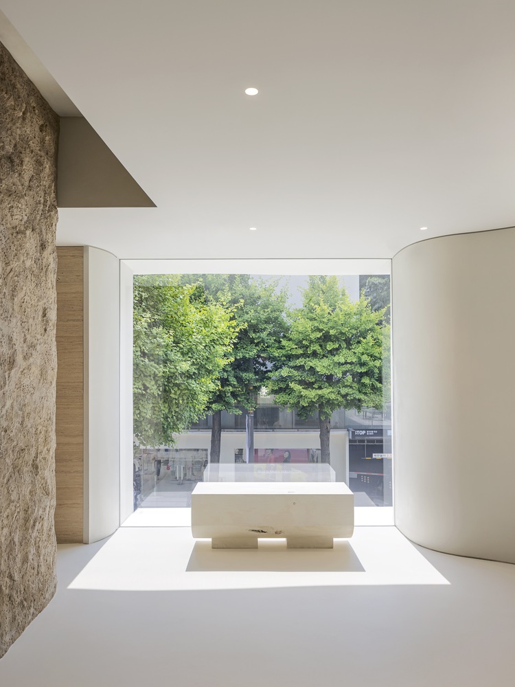 curved and fluid interiors redefine minimalism at polène paris seoul ...